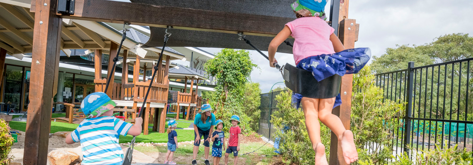 Swinging in the playground - Timber Tots Child Care